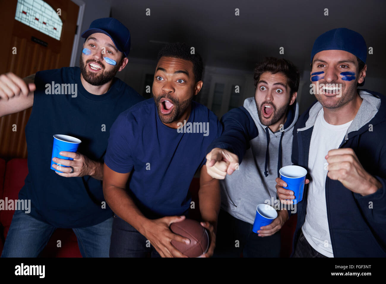 Group Of Male Sports Fans Watching Game On Television Stock Photo - Alamy
