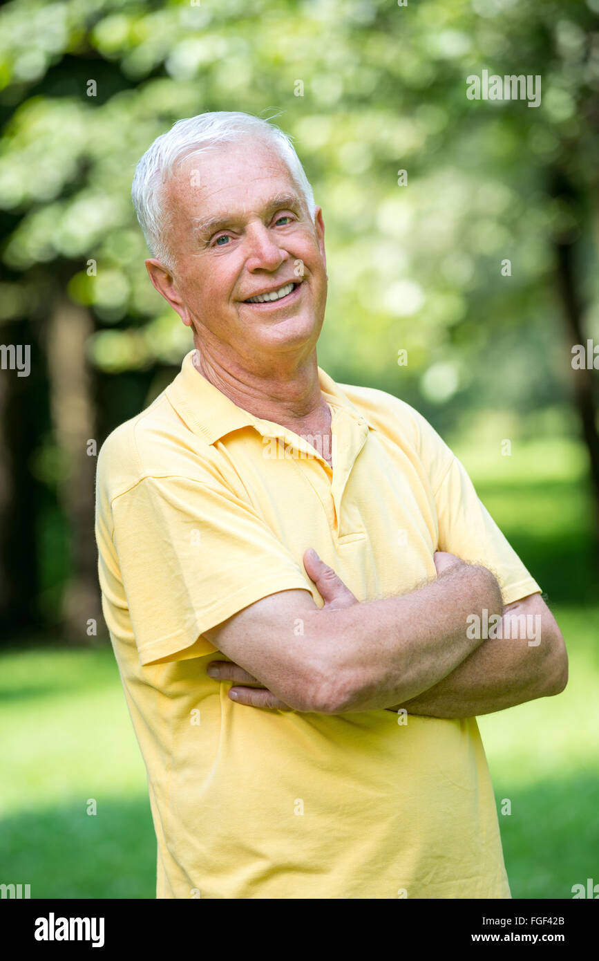Portrait of smiling elderly man Stock Photo - Alamy