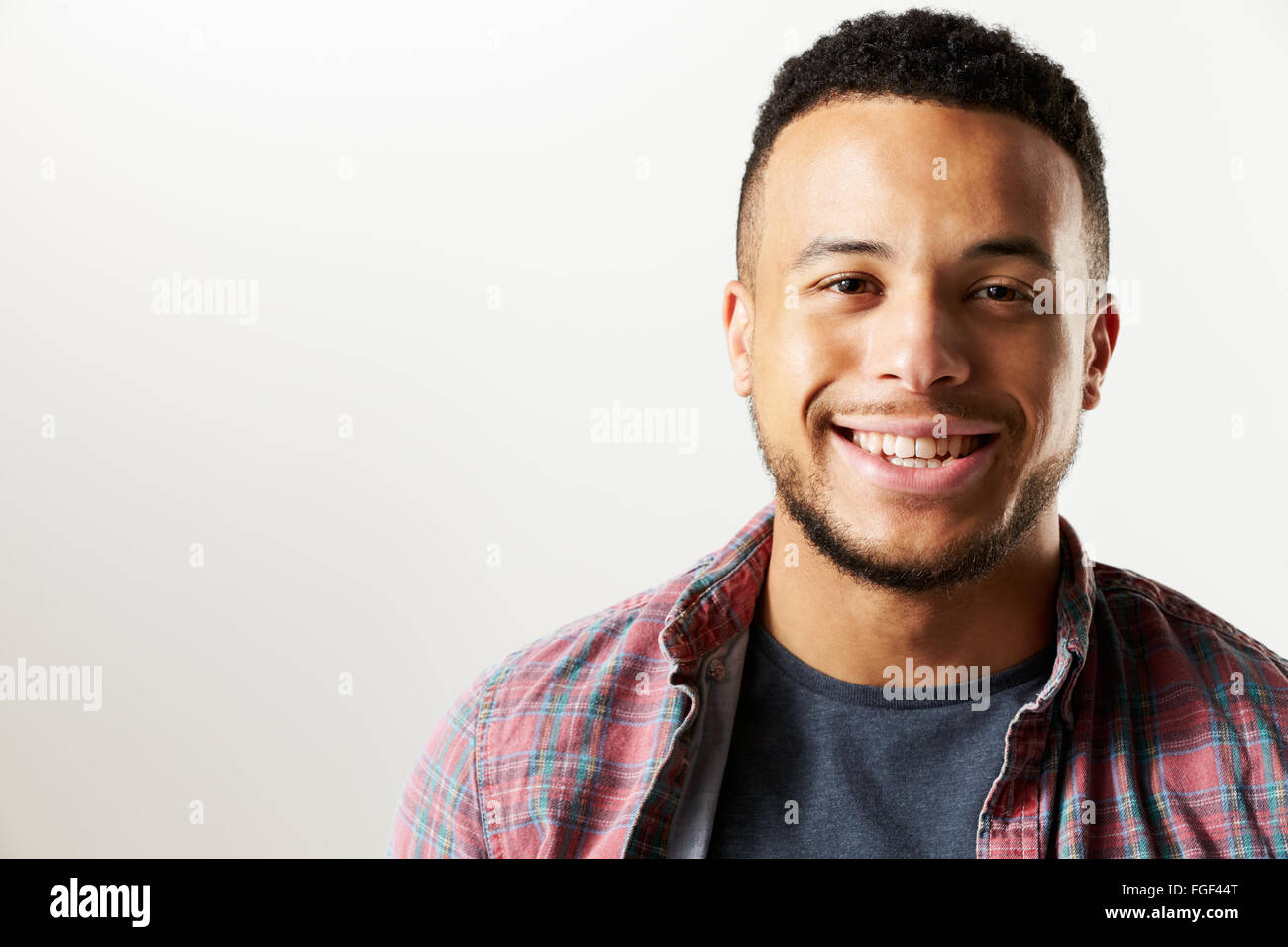 Studio Portrait Of Smiling Man Against White Background Stock Photo - Alamy