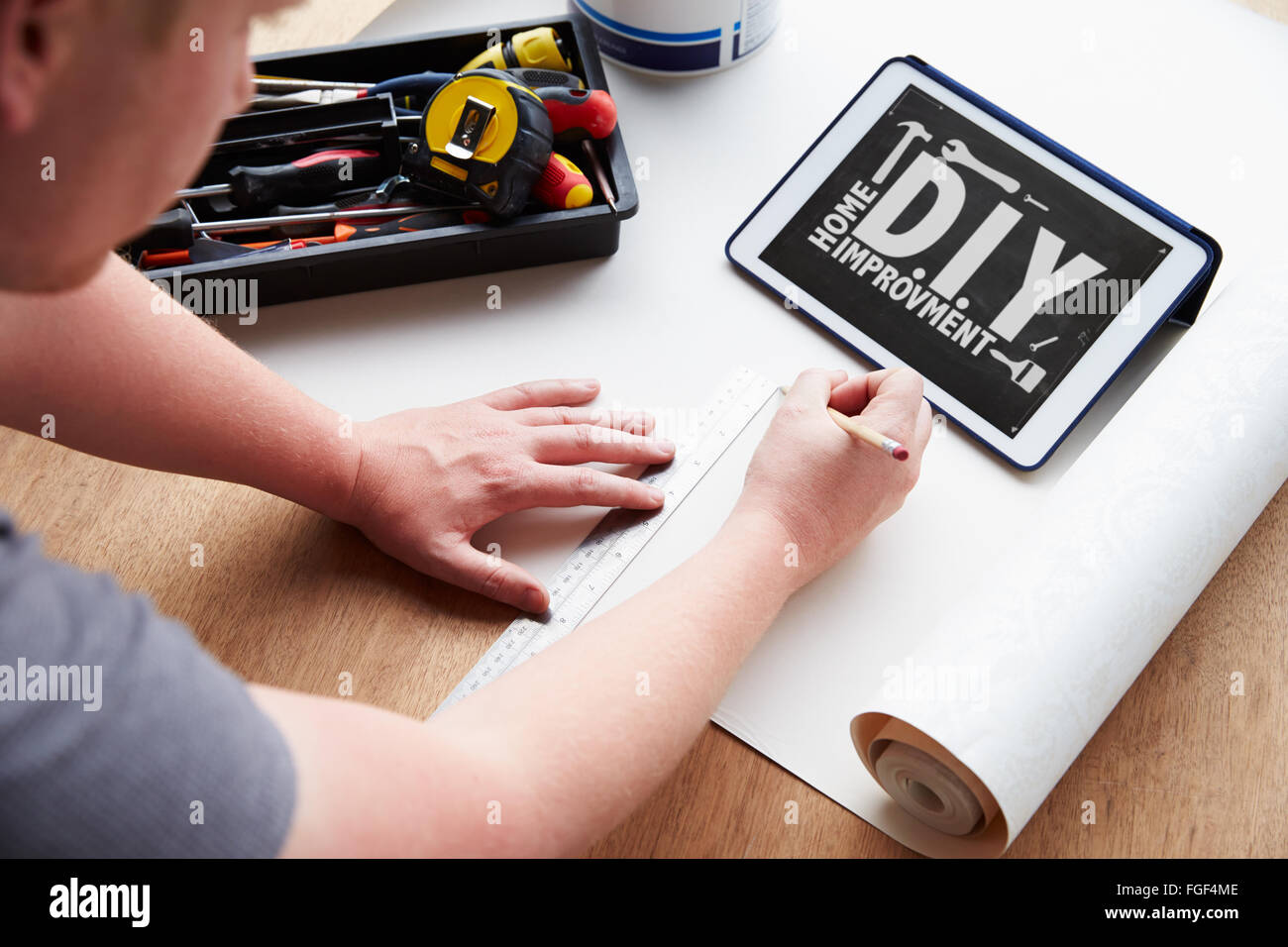 Man Plans Design Project Using Application On Digital Tablet Stock ...