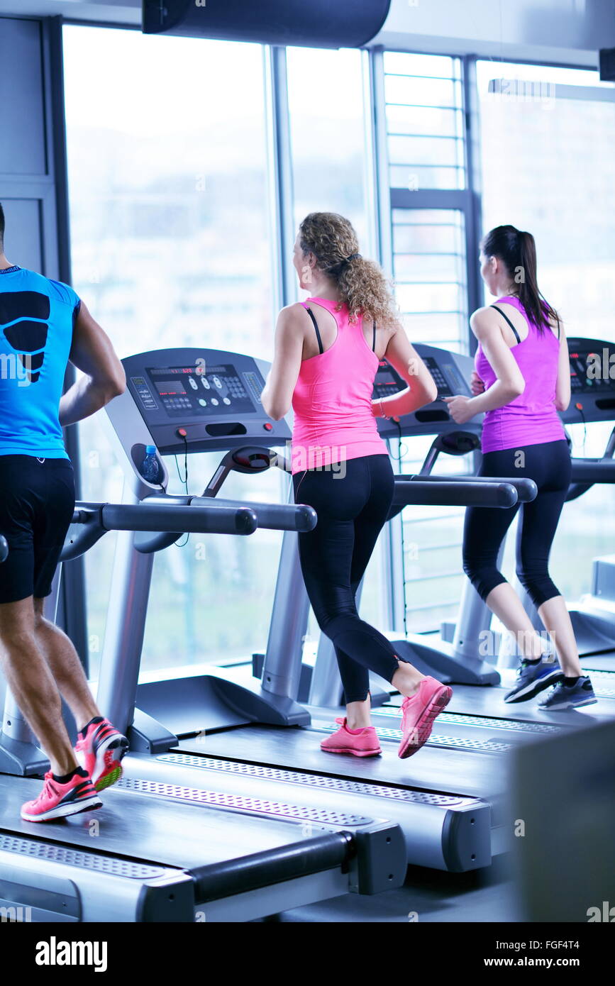 Group of people running on treadmills Stock Photo - Alamy
