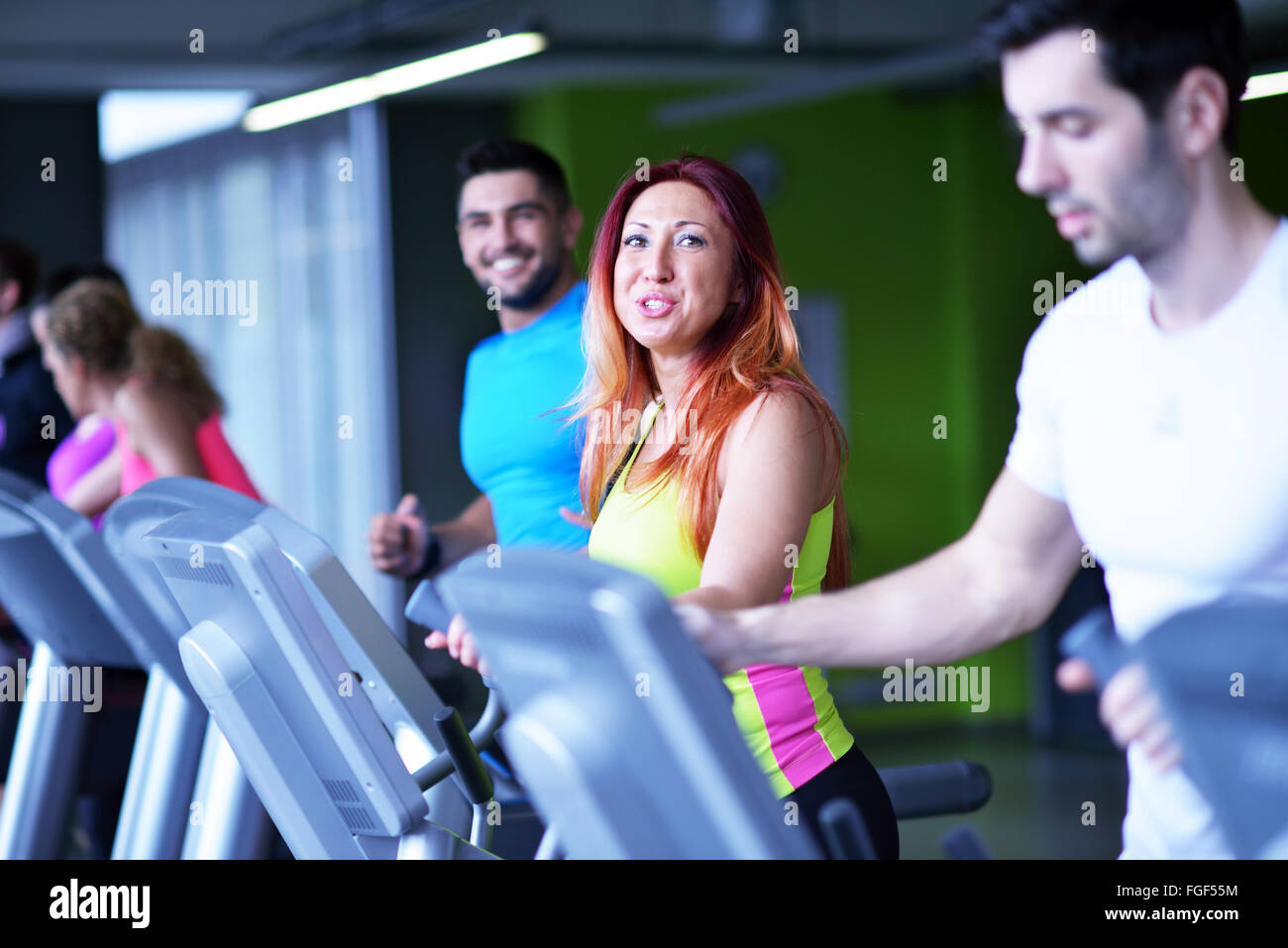 Group of people running on treadmills Stock Photo - Alamy