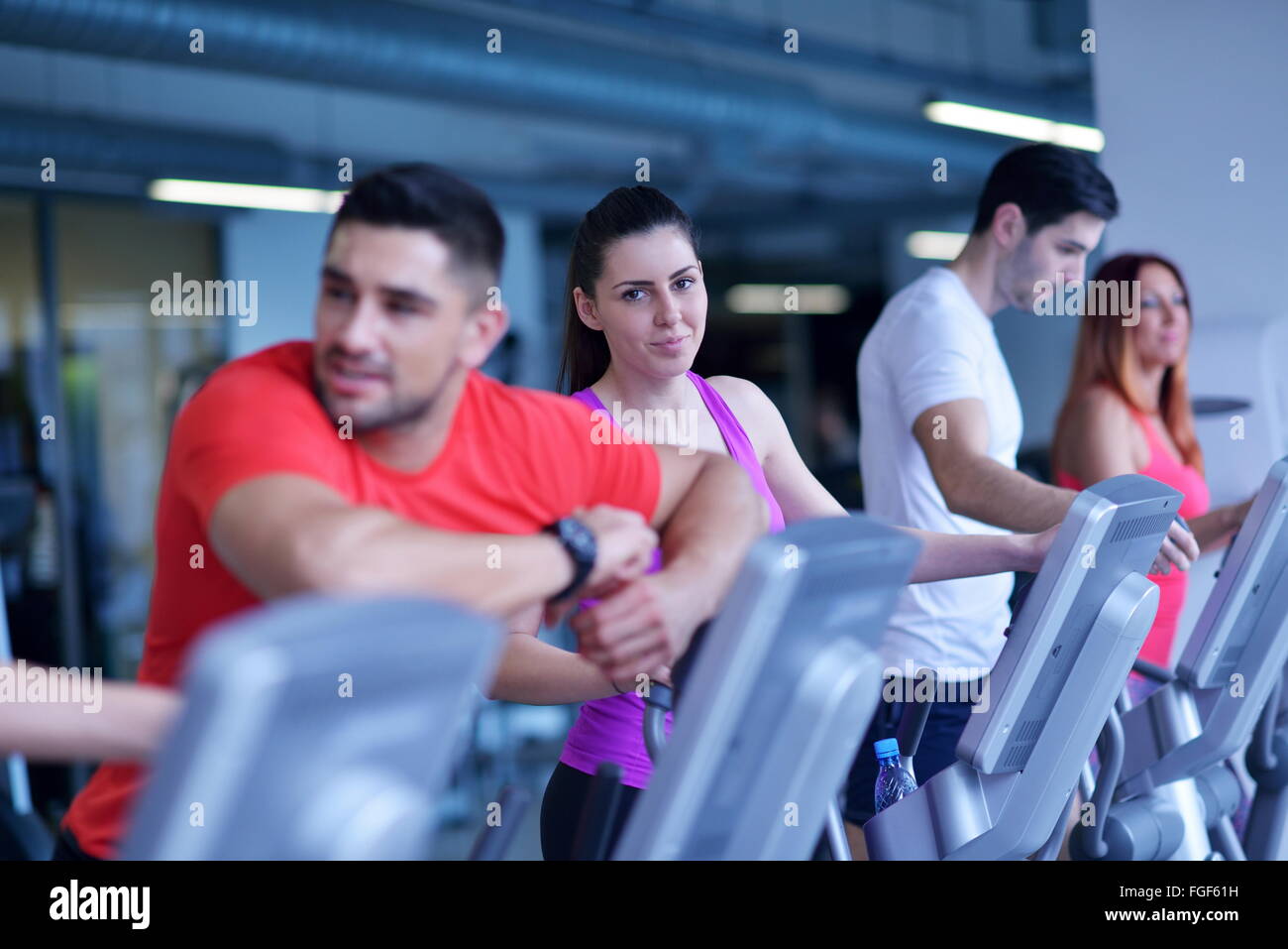 Group of people running on treadmills Stock Photo - Alamy