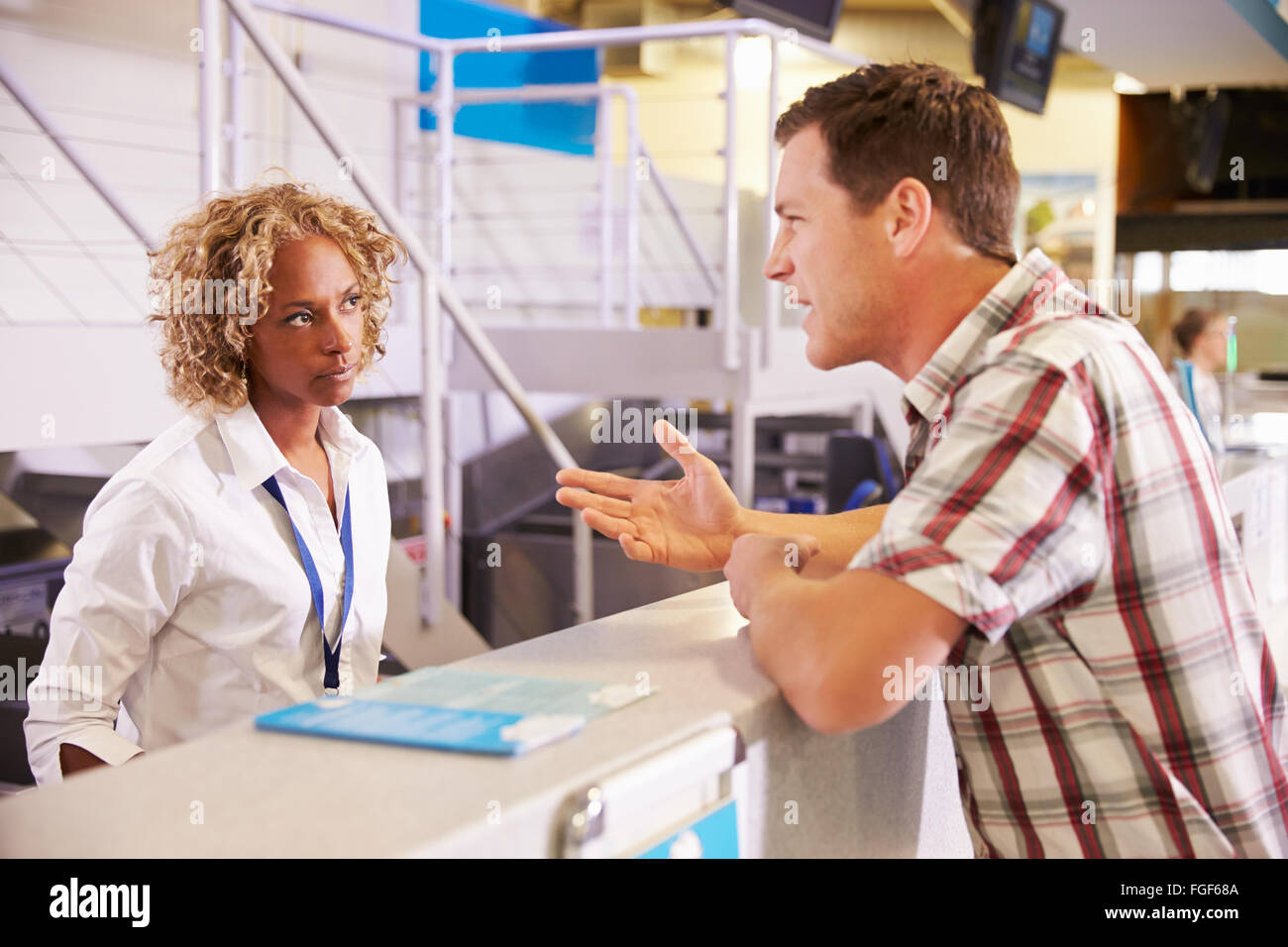 Man angry airport check in hi-res stock photography and images - Alamy
