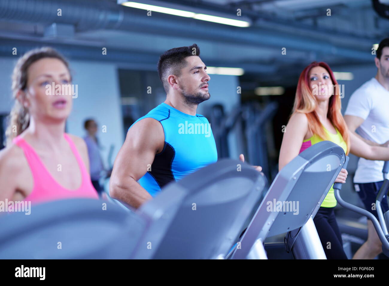 Group of people running on treadmills Stock Photo - Alamy