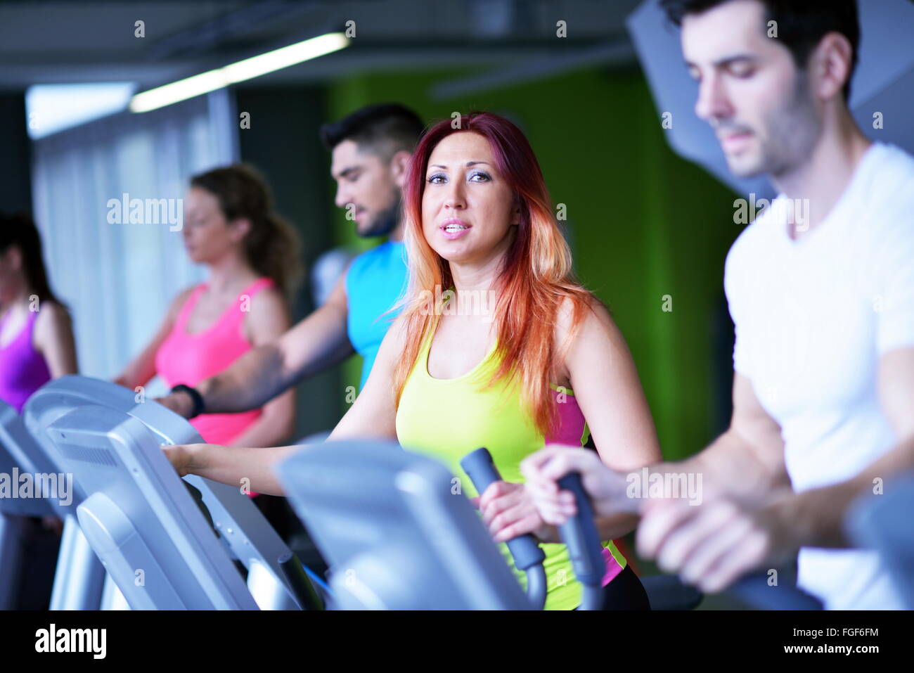 Group of people running on treadmills Stock Photo - Alamy