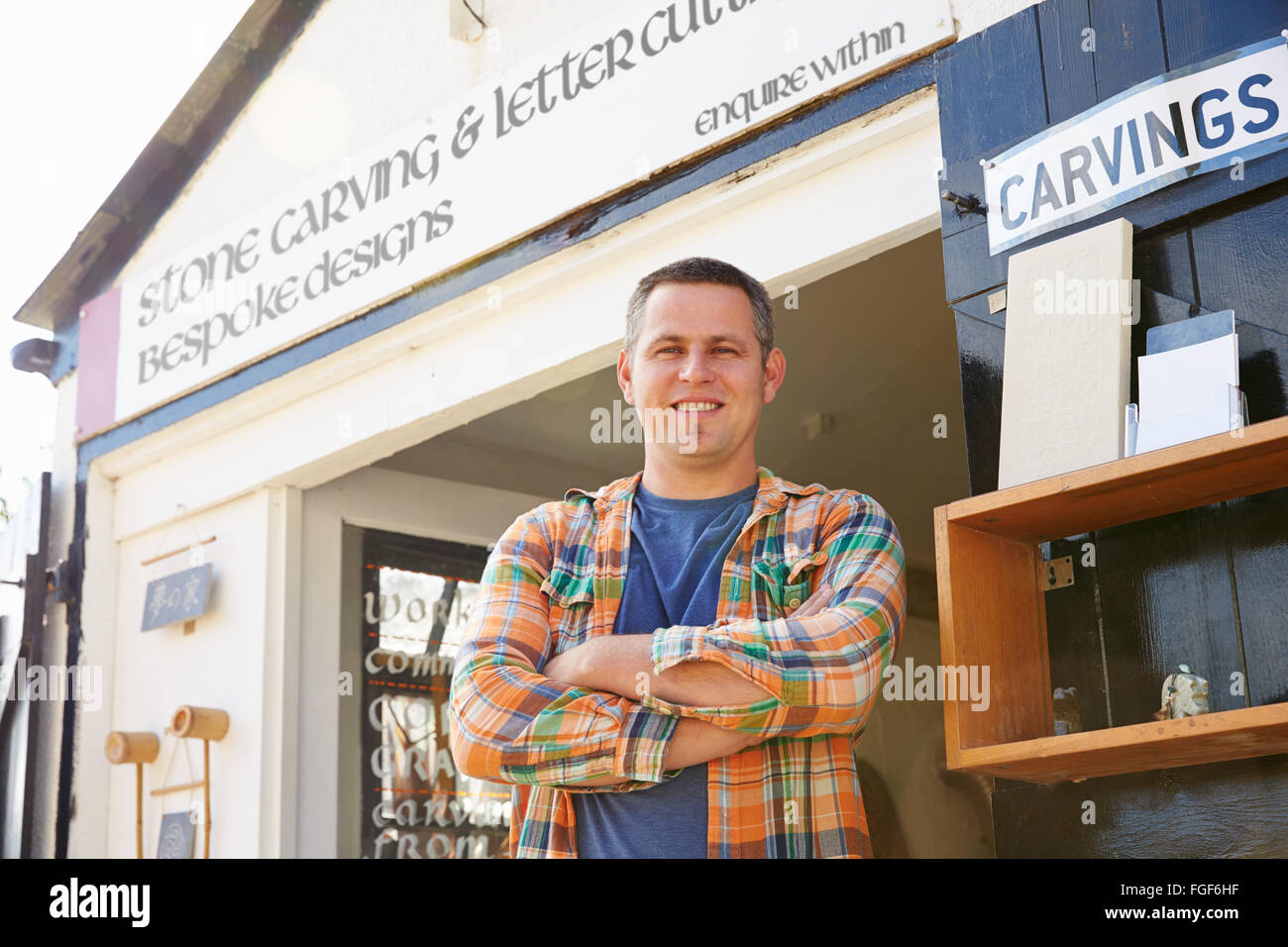 Portrait Of Stone Mason Standing Outside Workshop Stock Photo - Alamy