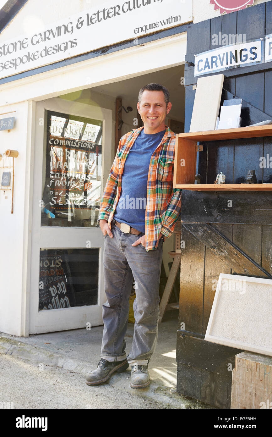 Portrait Of Stone Mason Standing Outside Workshop Stock Photo - Alamy