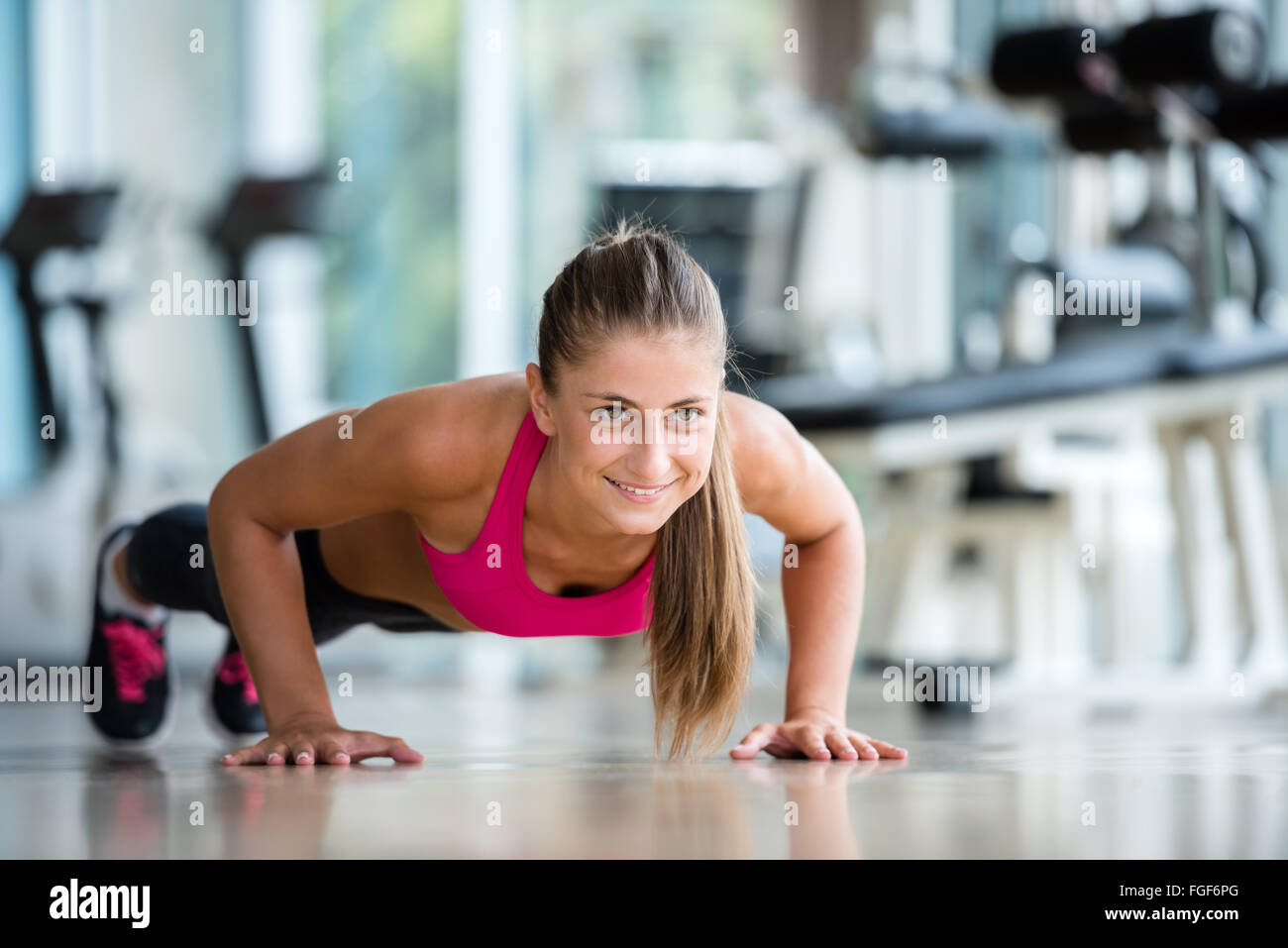 warming up and doing some push ups a the gym Stock Photo - Alamy