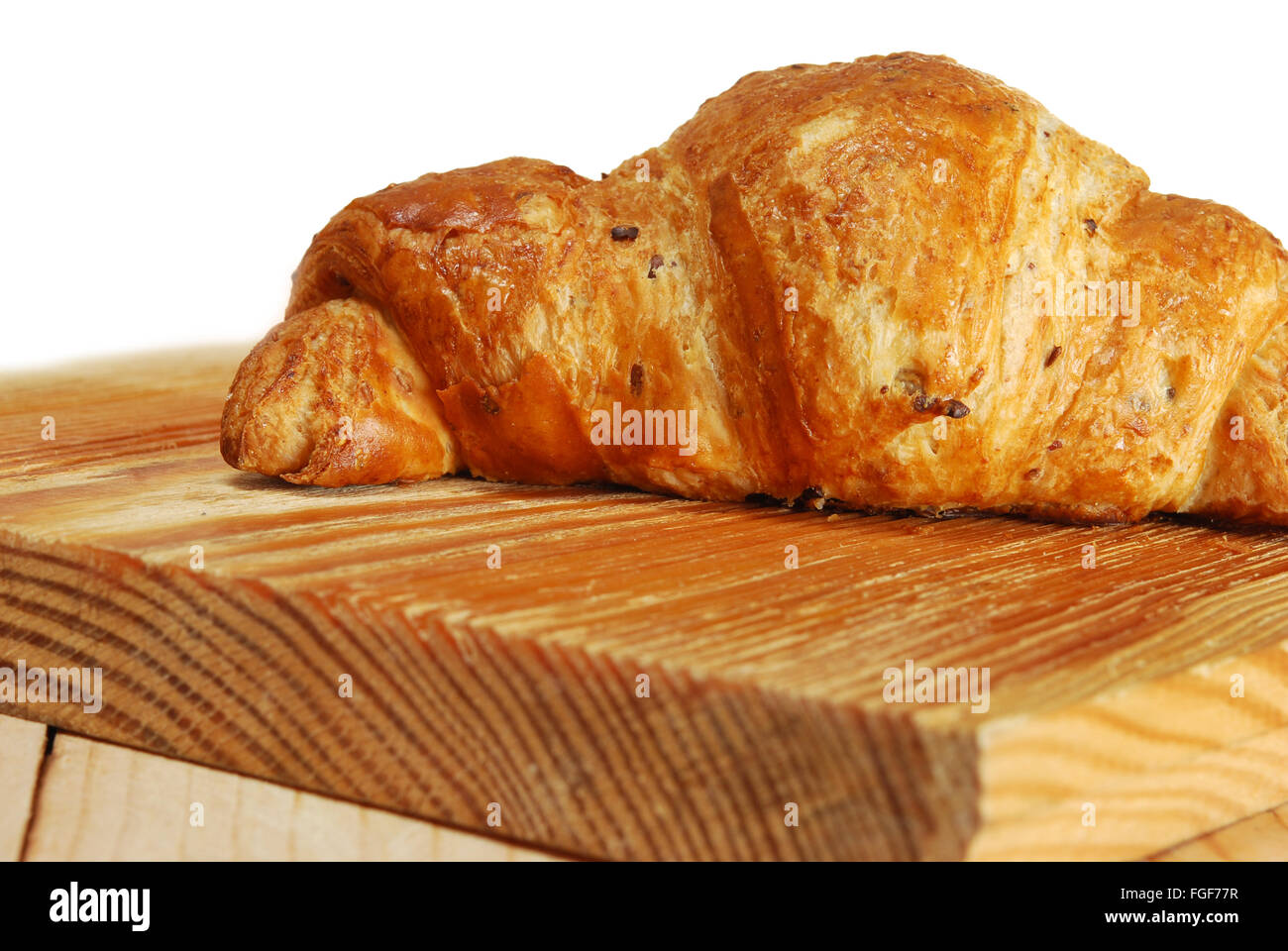 The part of crispy croissant on a wooden table Stock Photo - Alamy