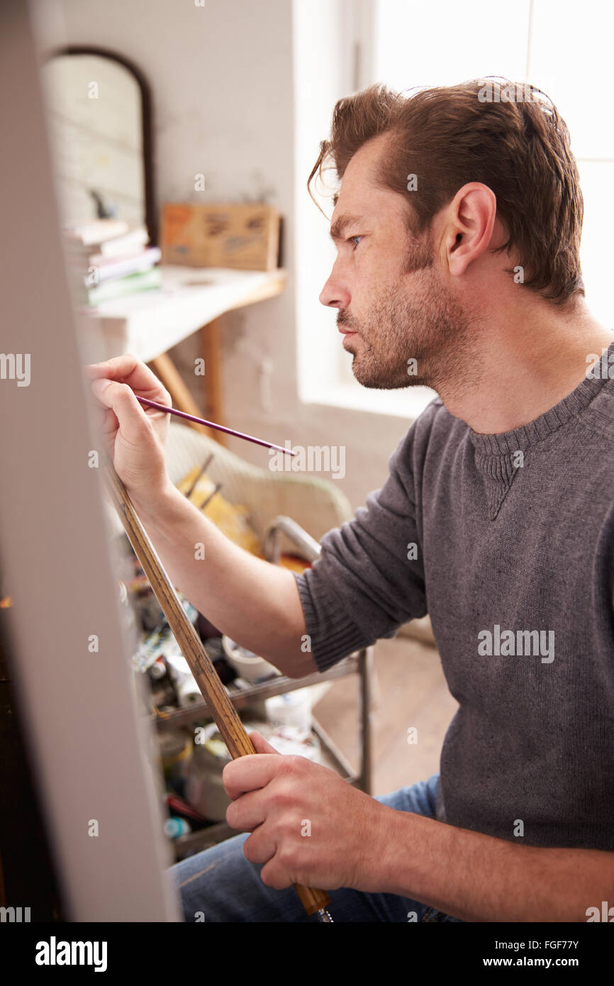 Male Artist Working On Painting In Studio Stock Photo - Alamy