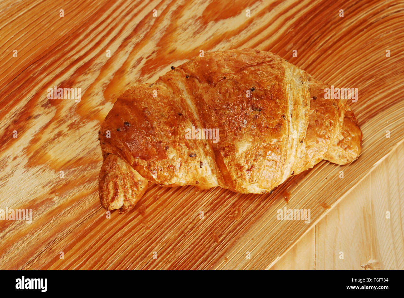 The crispy croissant on a wooden table Stock Photo - Alamy