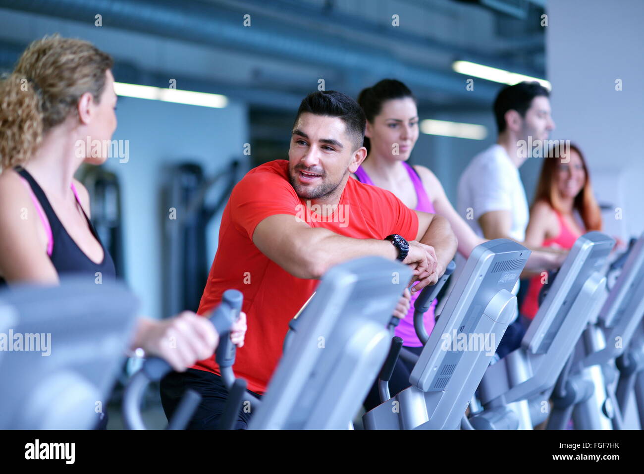 Group of people running on treadmills Stock Photo - Alamy