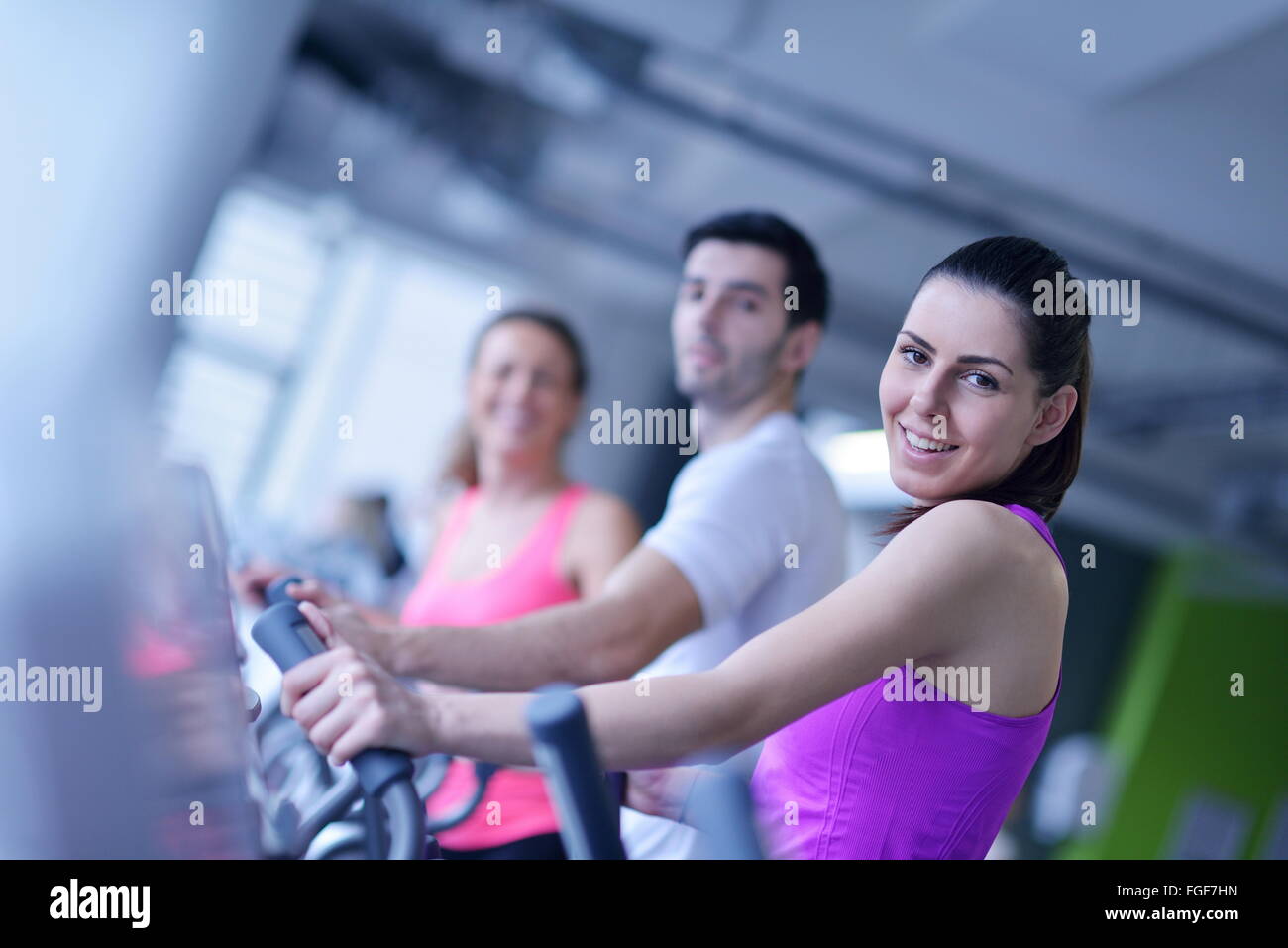 Group of people running on treadmills Stock Photo - Alamy