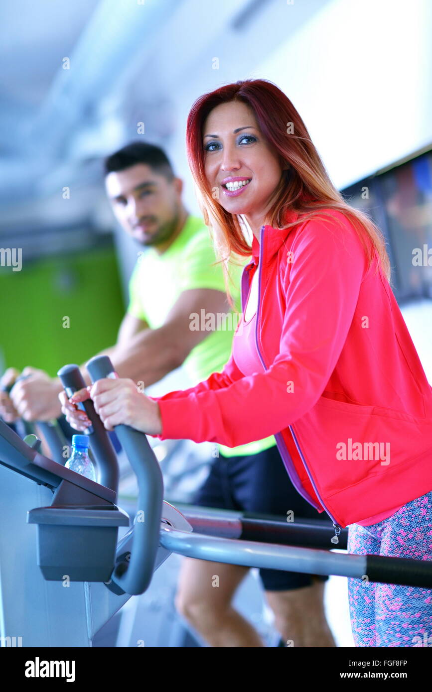 Group of people running on treadmills Stock Photo - Alamy
