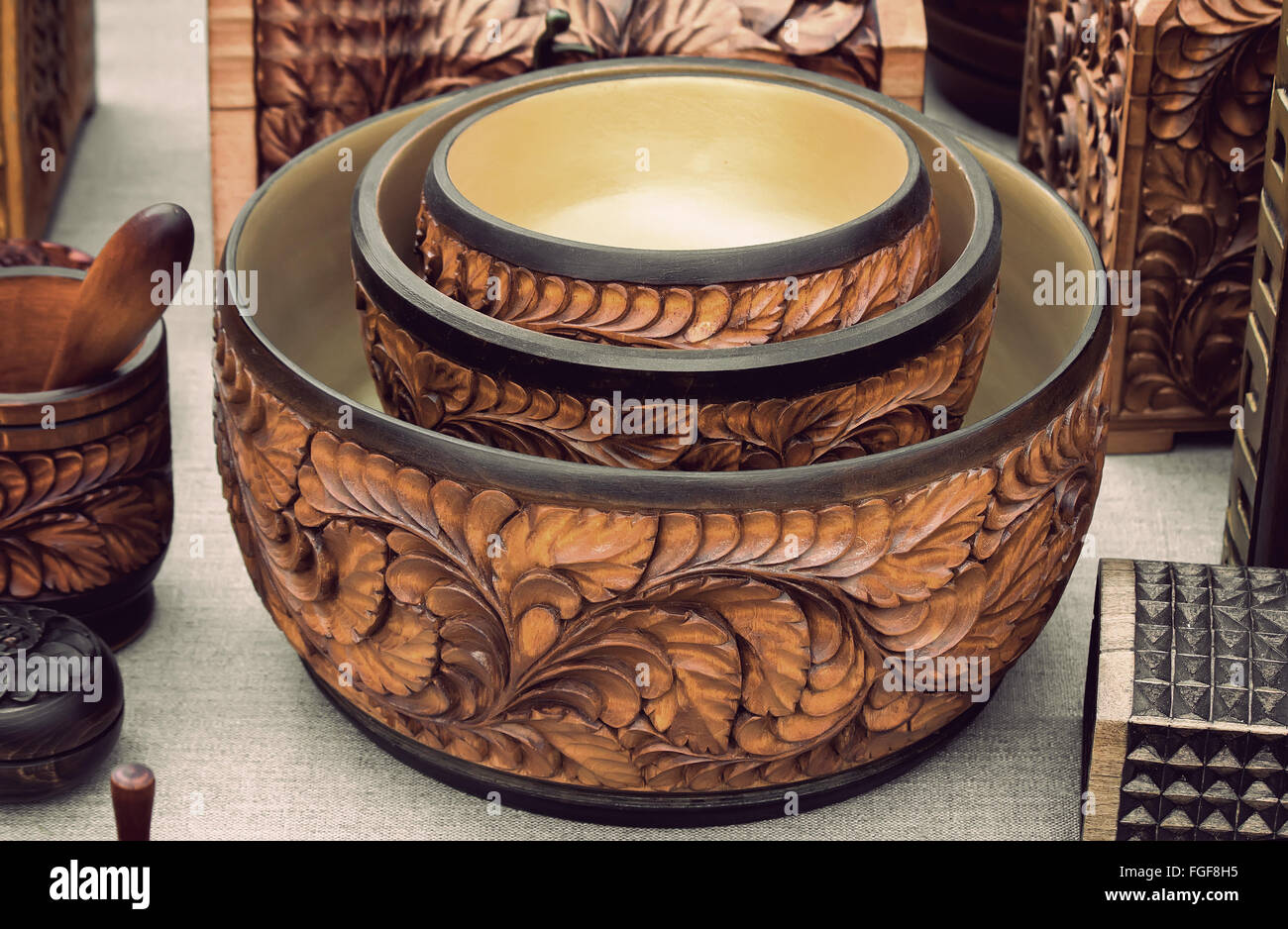 Original dishes made of wood, decorated with carvings. Handmade Stock ...
