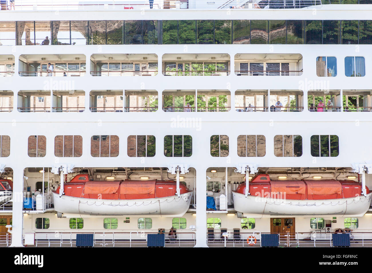cruise ship windows with passengers and tourists Stock Photo - Alamy