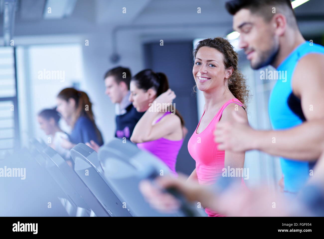 Group of people running on treadmills Stock Photo - Alamy