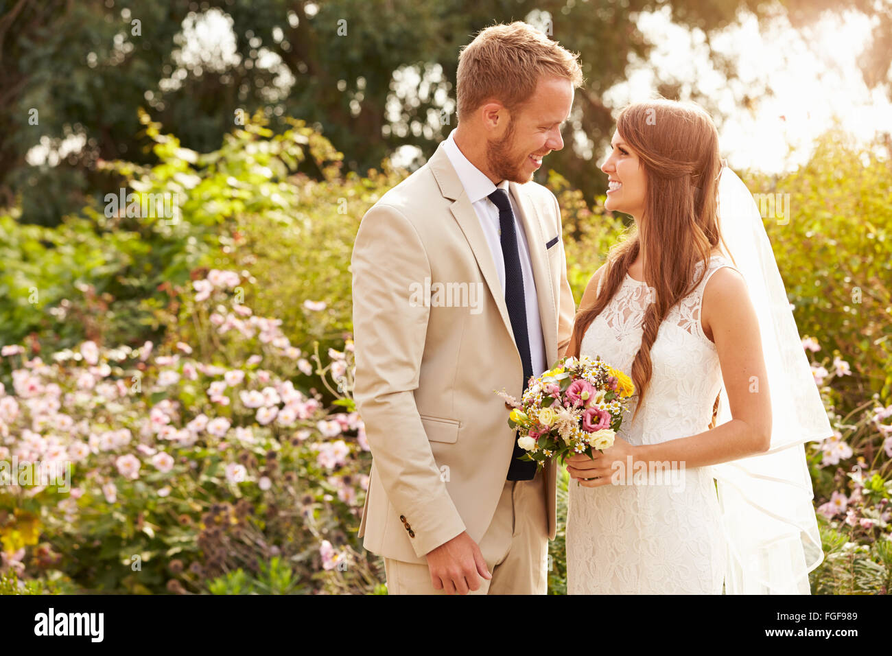 Romantic Young Couple Getting Married Outdoors Stock Photo - Alamy