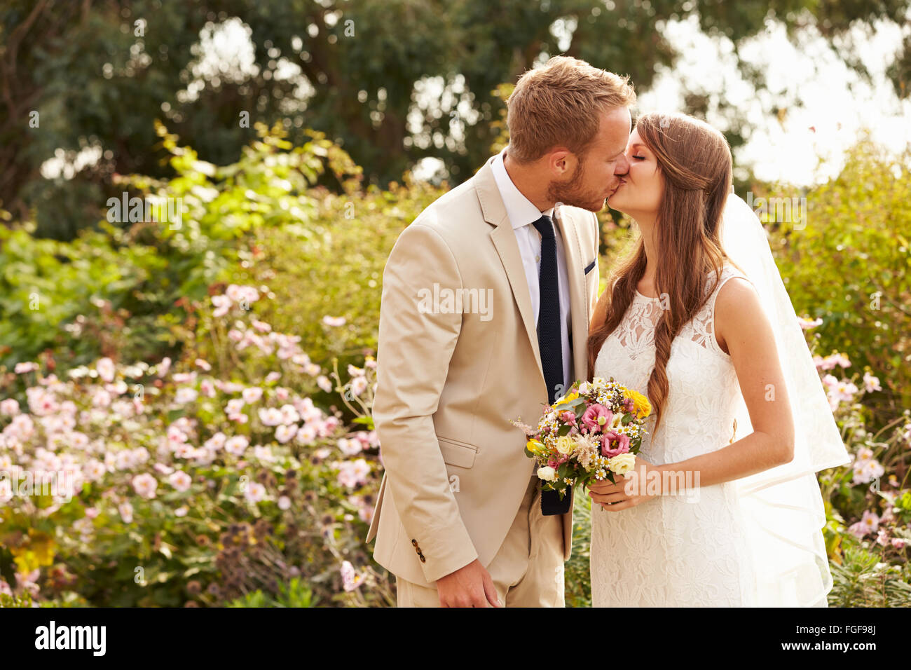 Romantic Young Couple Getting Married Outdoors Stock Photo - Alamy
