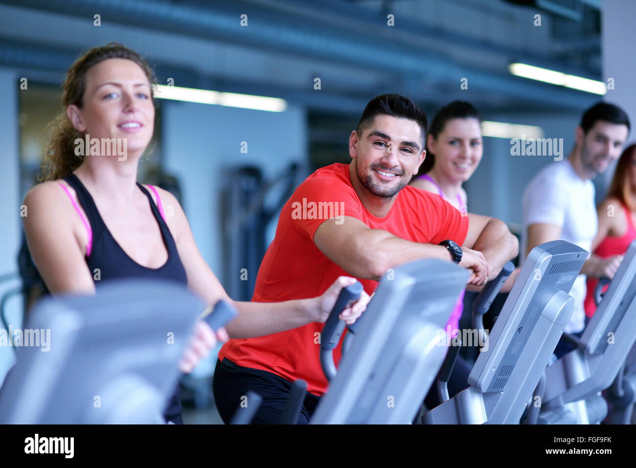 Group of people running on treadmills Stock Photo - Alamy