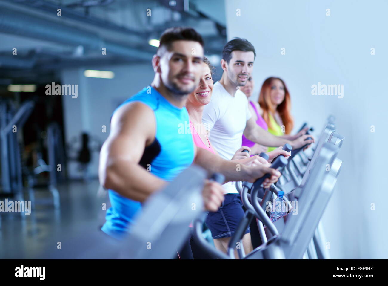 Group of people running on treadmills Stock Photo - Alamy