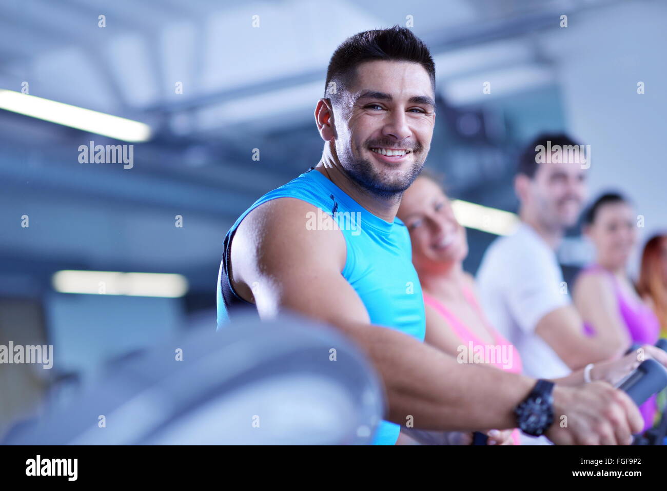 Group of people running on treadmills Stock Photo - Alamy