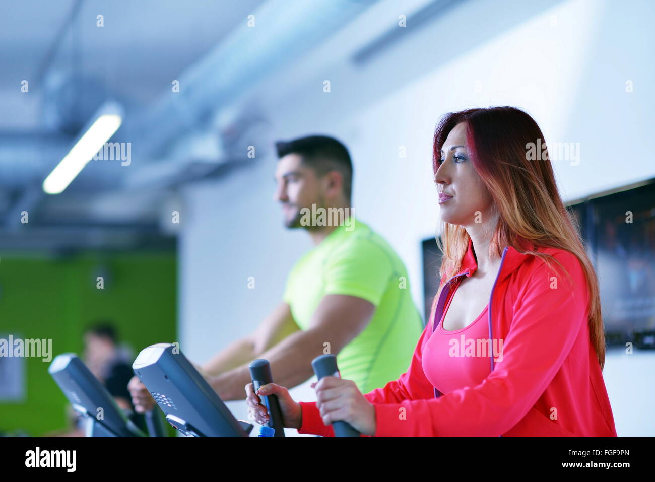 Group of people running on treadmills Stock Photo - Alamy