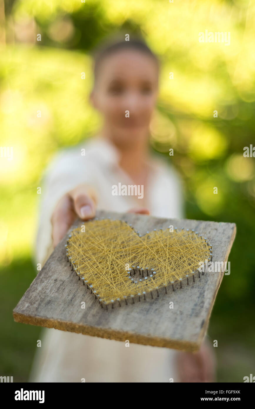 Hand offering heart symbol hi-res stock photography and images - Alamy