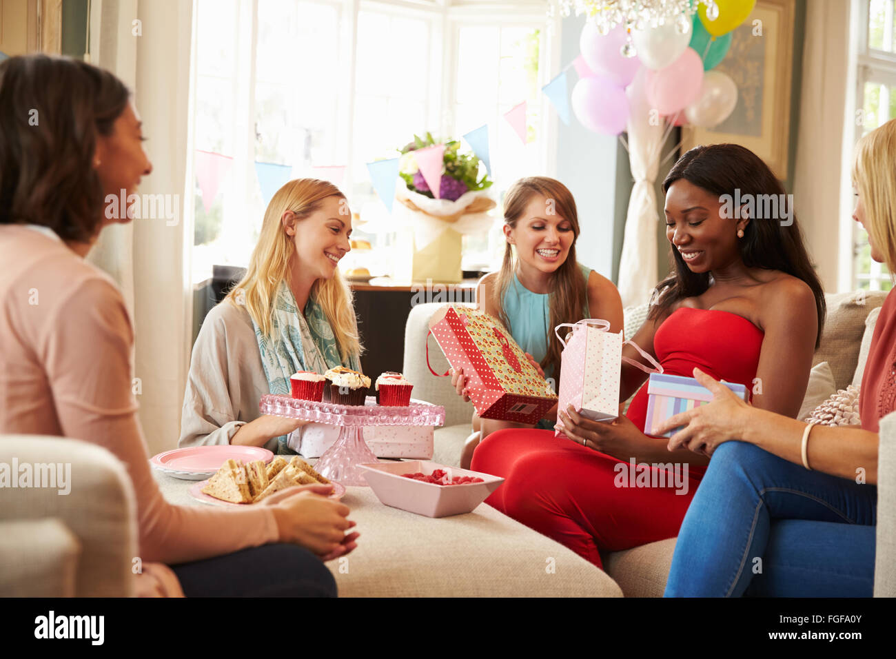 Group Of Female Friends Meeting For Baby Shower At Home Stock Photo - Alamy