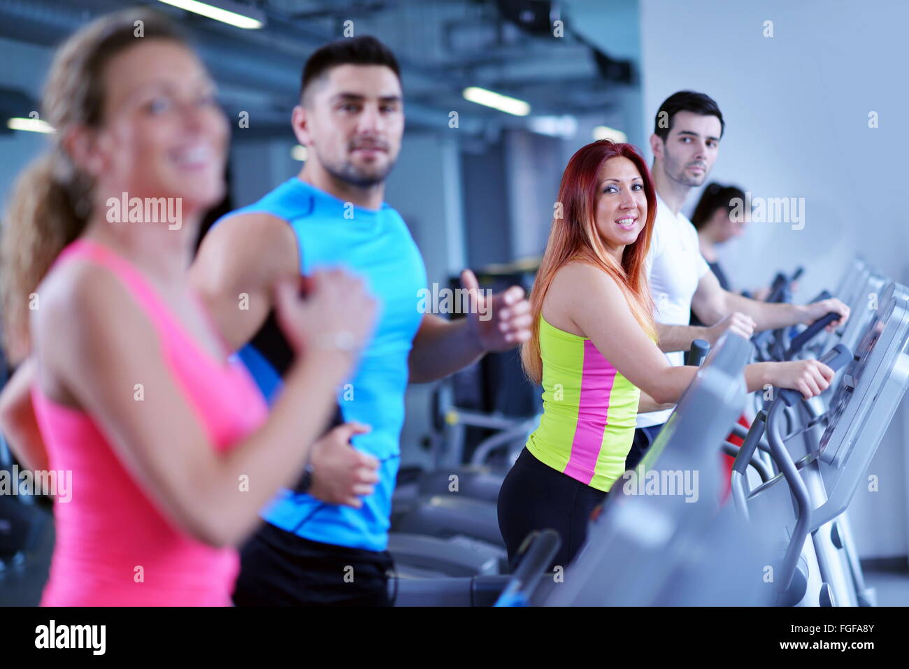 Group of people running on treadmills Stock Photo - Alamy