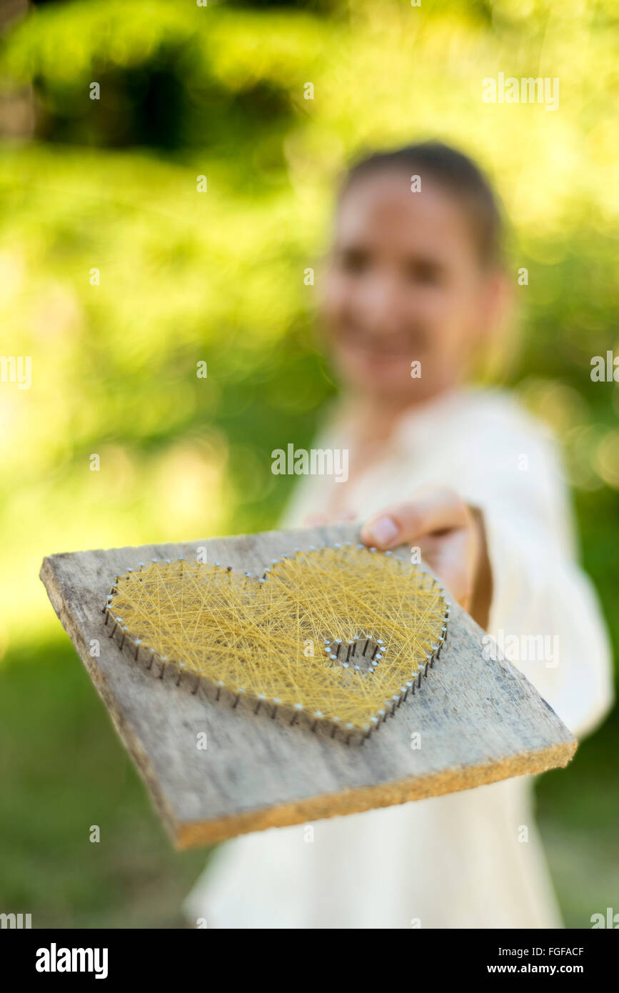 Hand offering heart symbol hi-res stock photography and images - Alamy