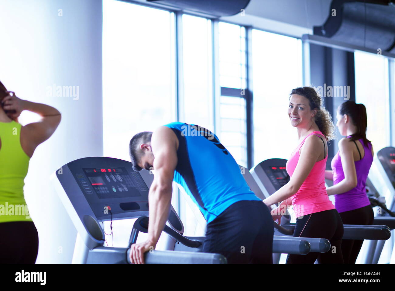Group of people running on treadmills Stock Photo - Alamy