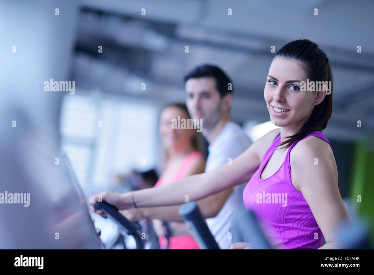 Group of people running on treadmills Stock Photo - Alamy