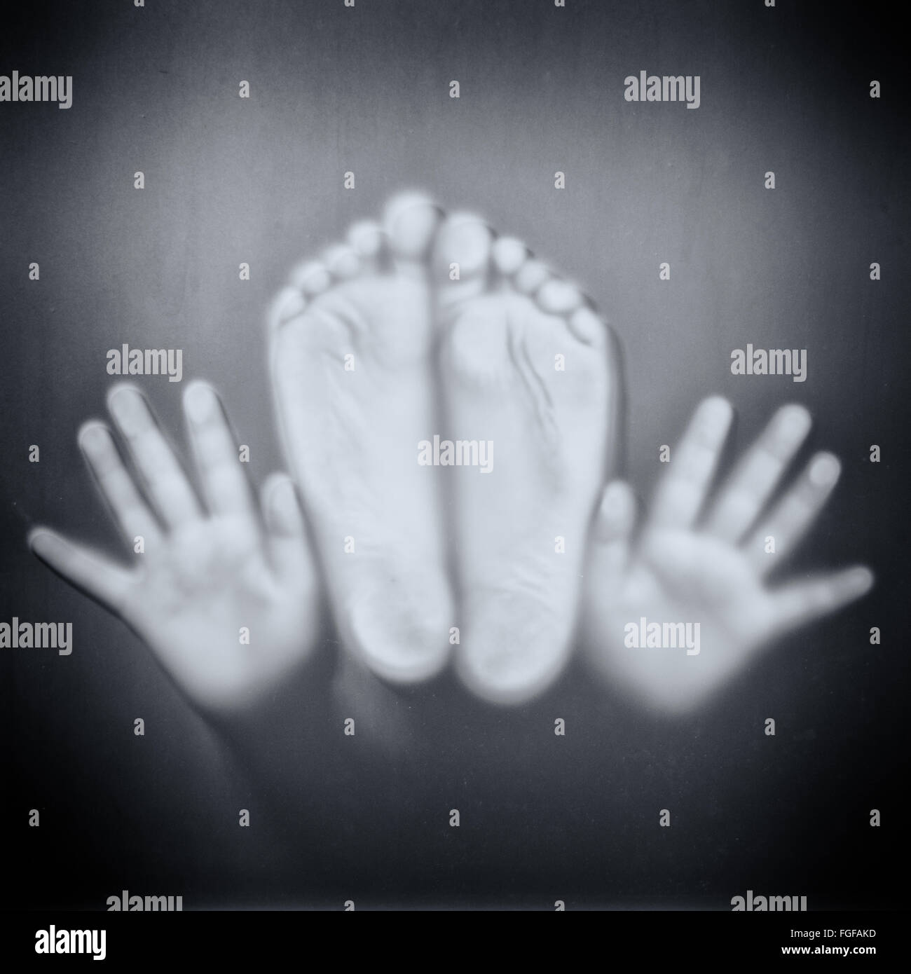 human feet and hands touching glass black and white effect Stock Photo ...