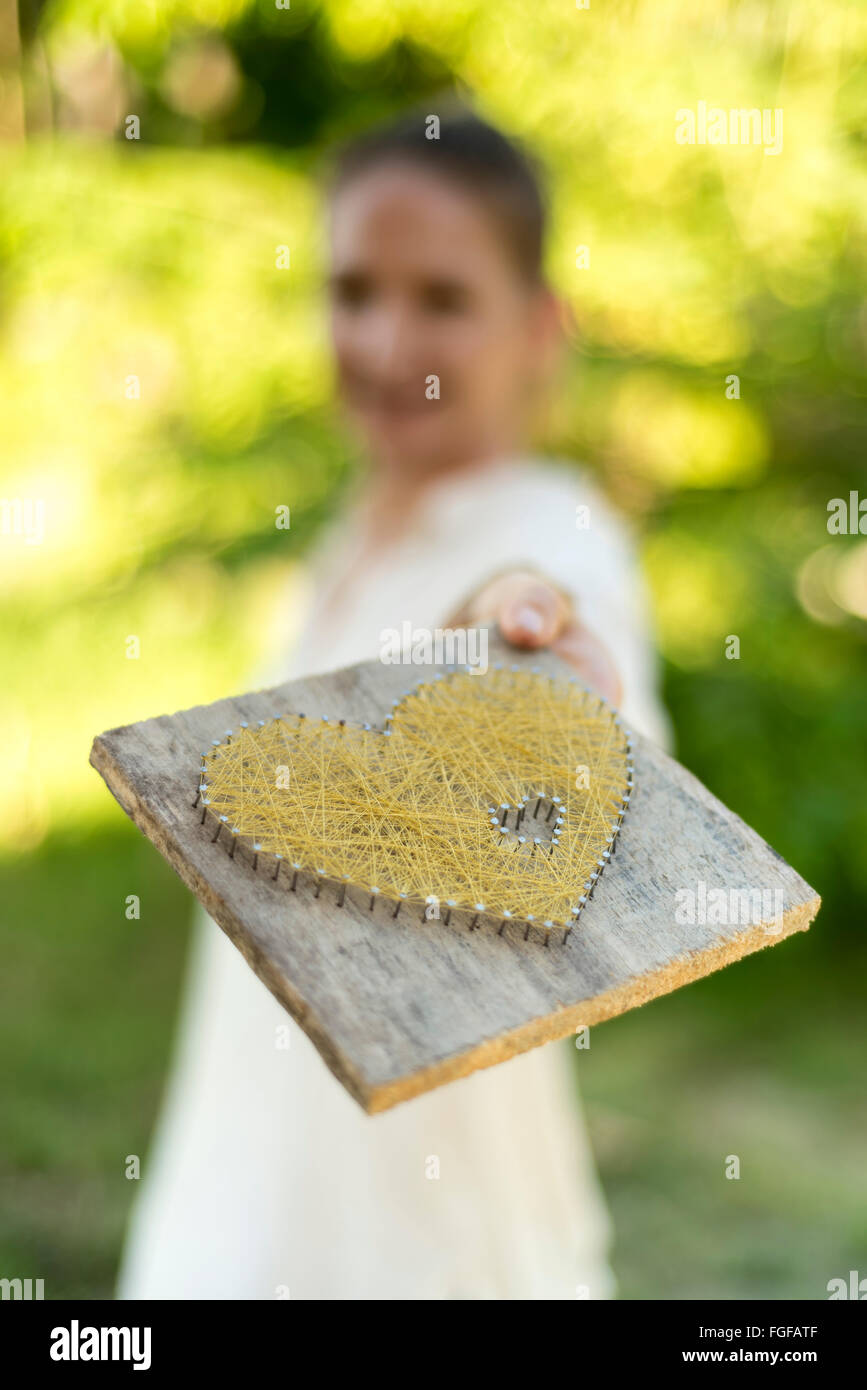 Hand offering heart symbol hi-res stock photography and images - Alamy