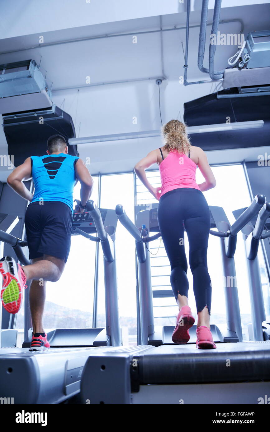 Group of people running on treadmills Stock Photo - Alamy