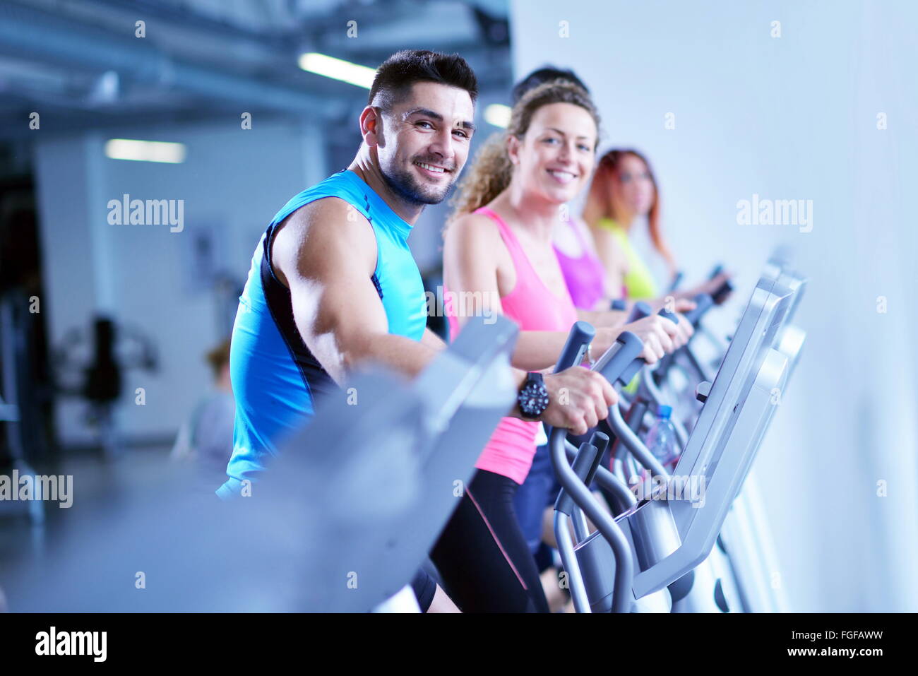 Group of people running on treadmills Stock Photo - Alamy