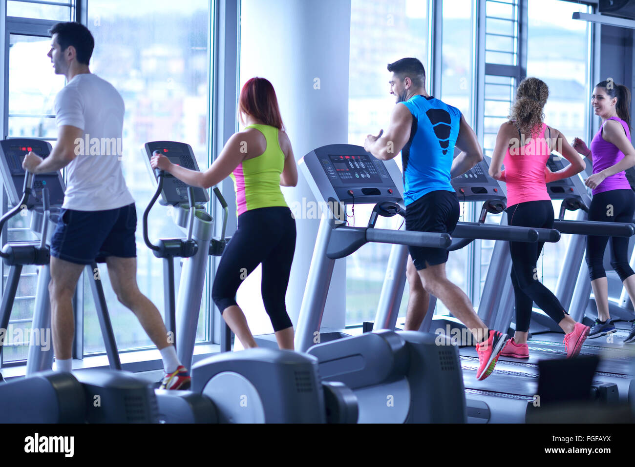 Group of people running on treadmills Stock Photo - Alamy