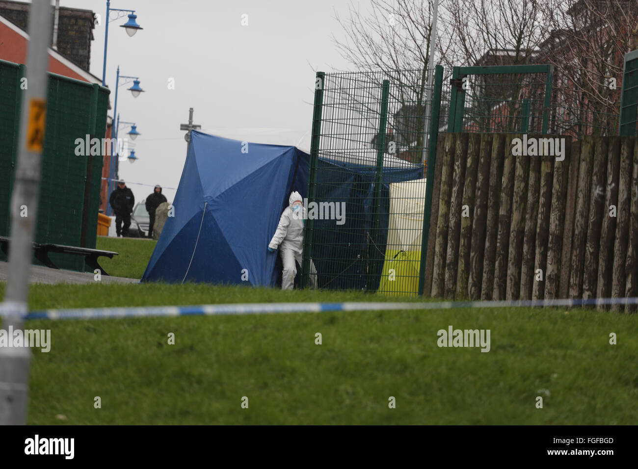 Rochdale, UK. 19th Feb, 2016. A crime scene investigator appearing out ...