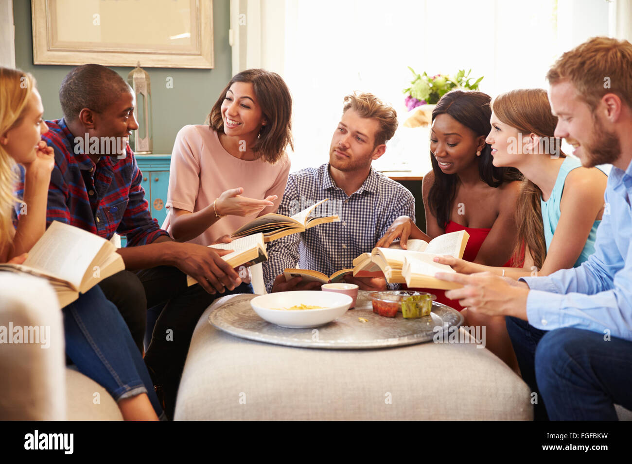 Group Of Friends Taking Part In Book Club At Home Stock Photo - Alamy