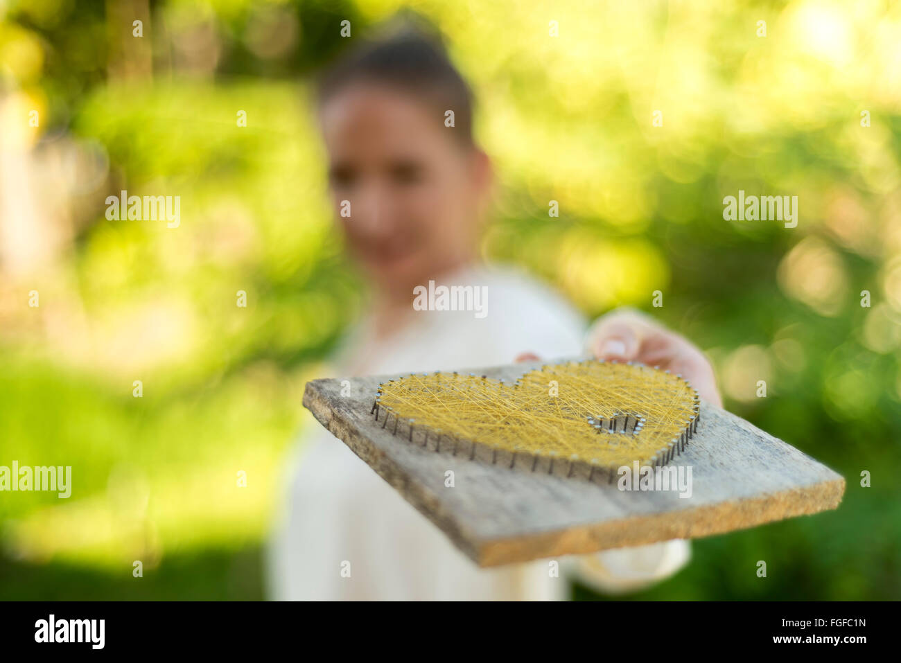 Hand offering heart symbol hi-res stock photography and images - Alamy