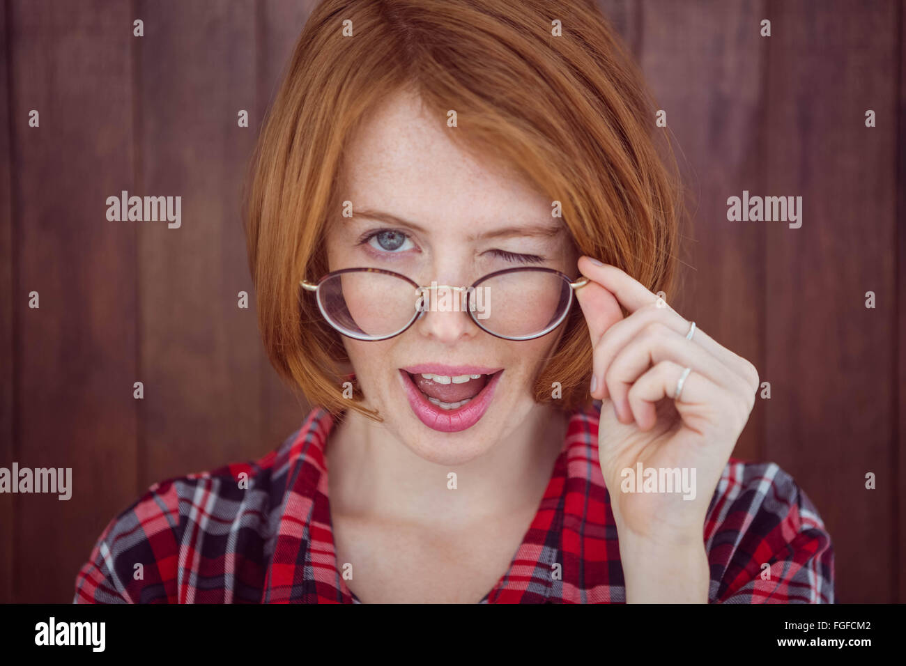 beautiful hipster woman winking at the camera Stock Photo - Alamy
