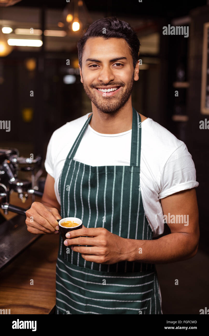 Smiling waiter drinking a coffee Stock Photo - Alamy