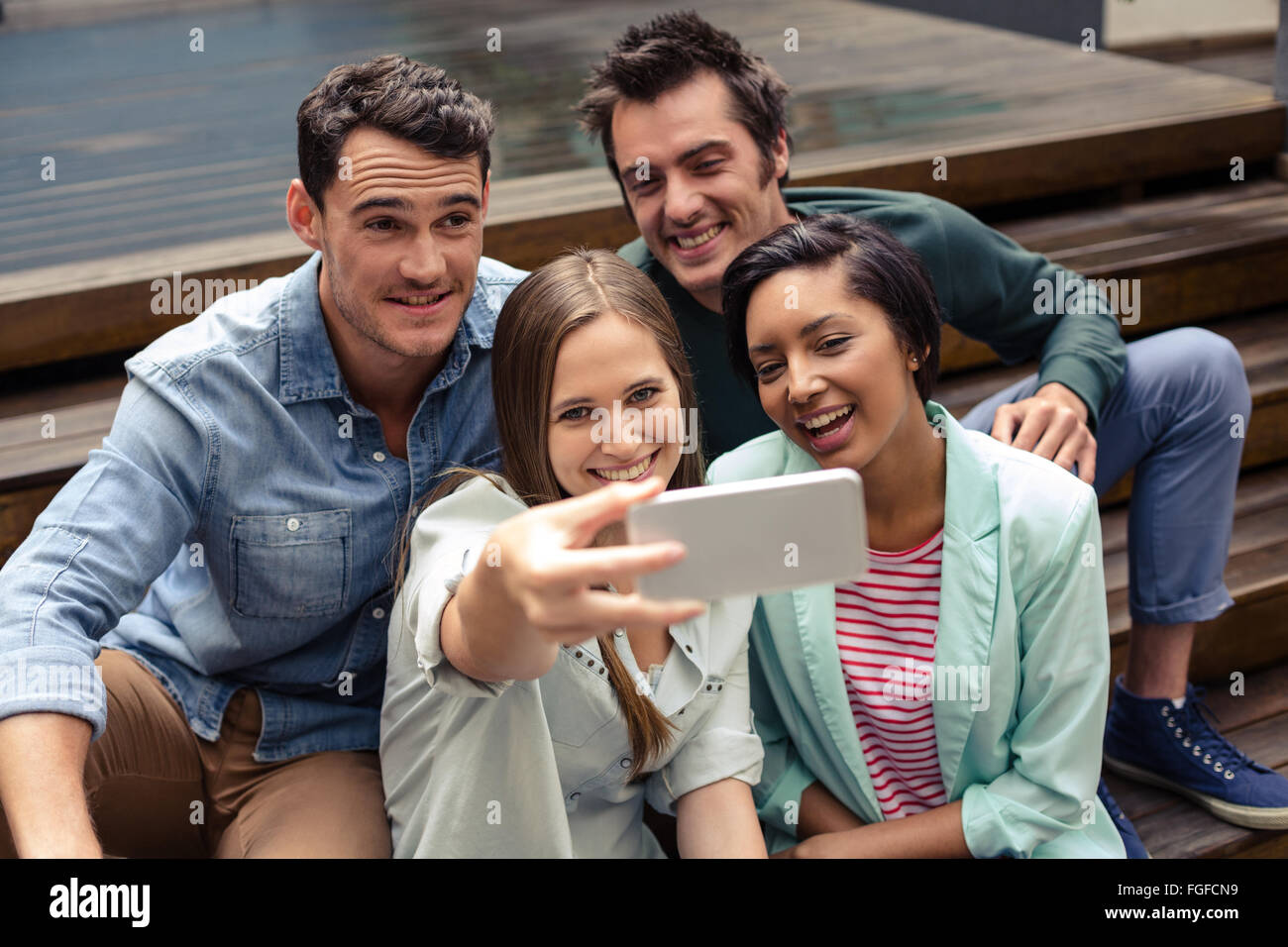 Happy friends taking selfie Stock Photo - Alamy