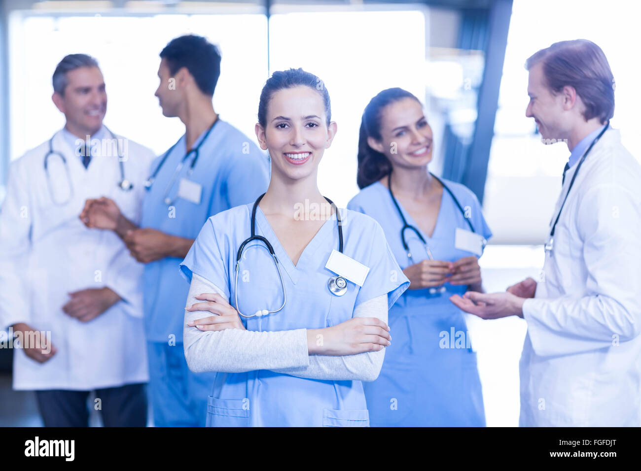 Female doctor standing in front and smiling at camera Stock Photo - Alamy