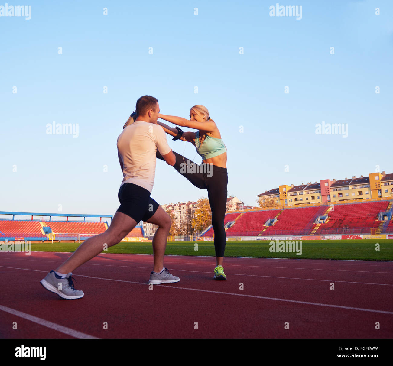 sporty woman on athletic race track Stock Photo - Alamy