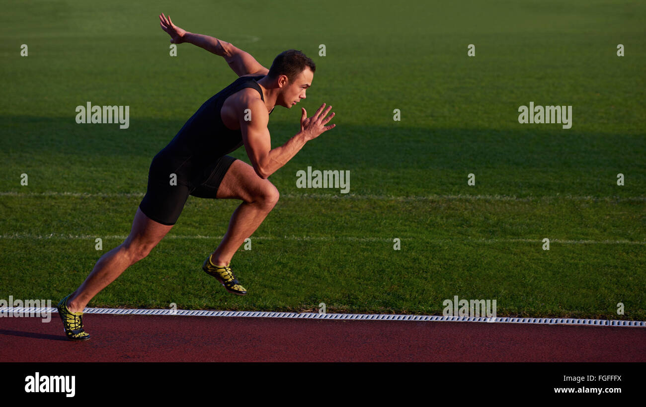 Athletic man start Stock Photo - Alamy