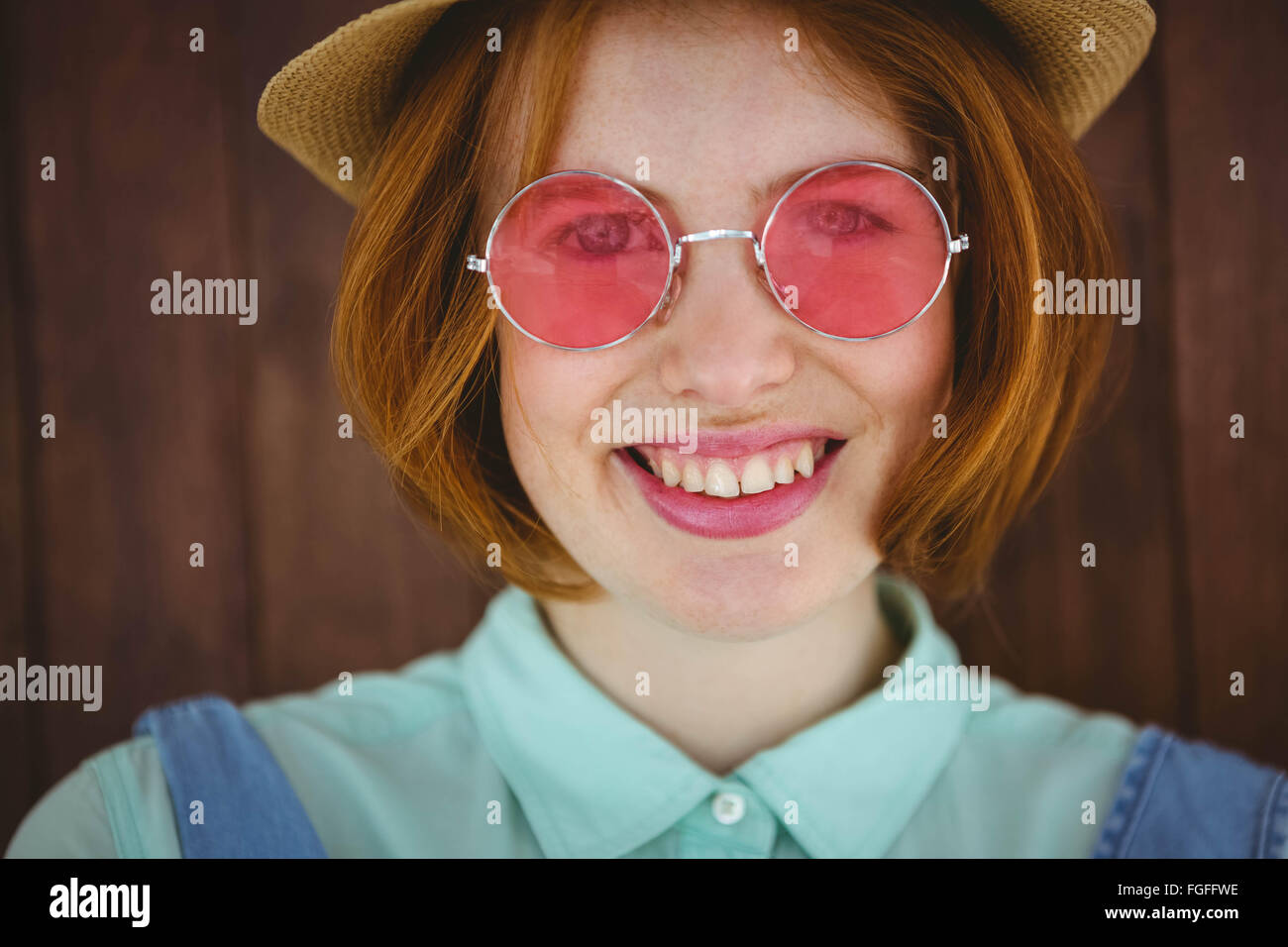 Cute red haired hipster smiling to the camera Stock Photo - Alamy