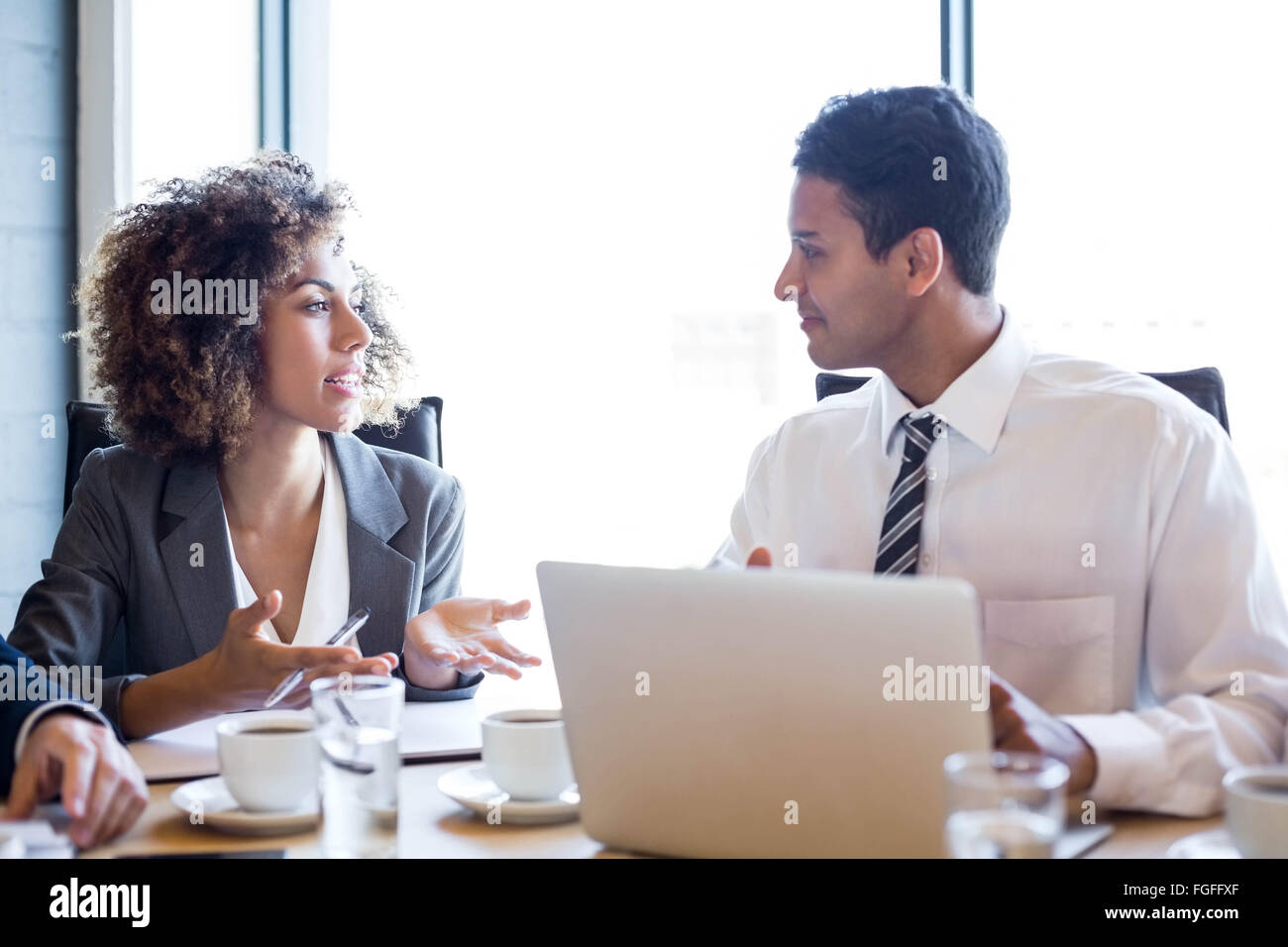 Businesspeople having a discussion in conference room Stock Photo - Alamy